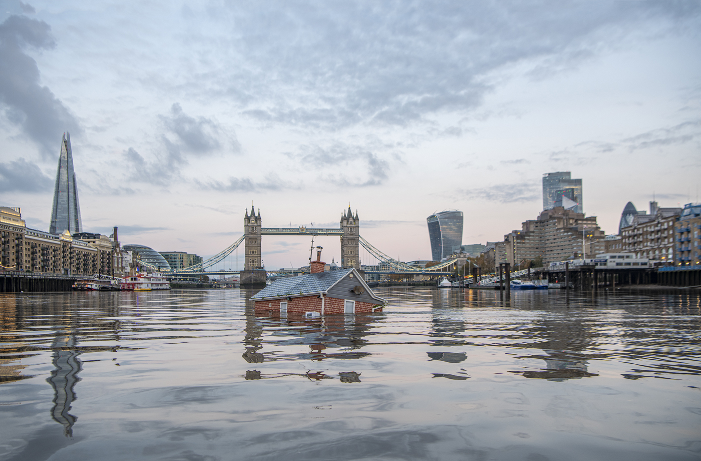 Extinction Rebellion Sends a Sinking Home Along the River Thames ...